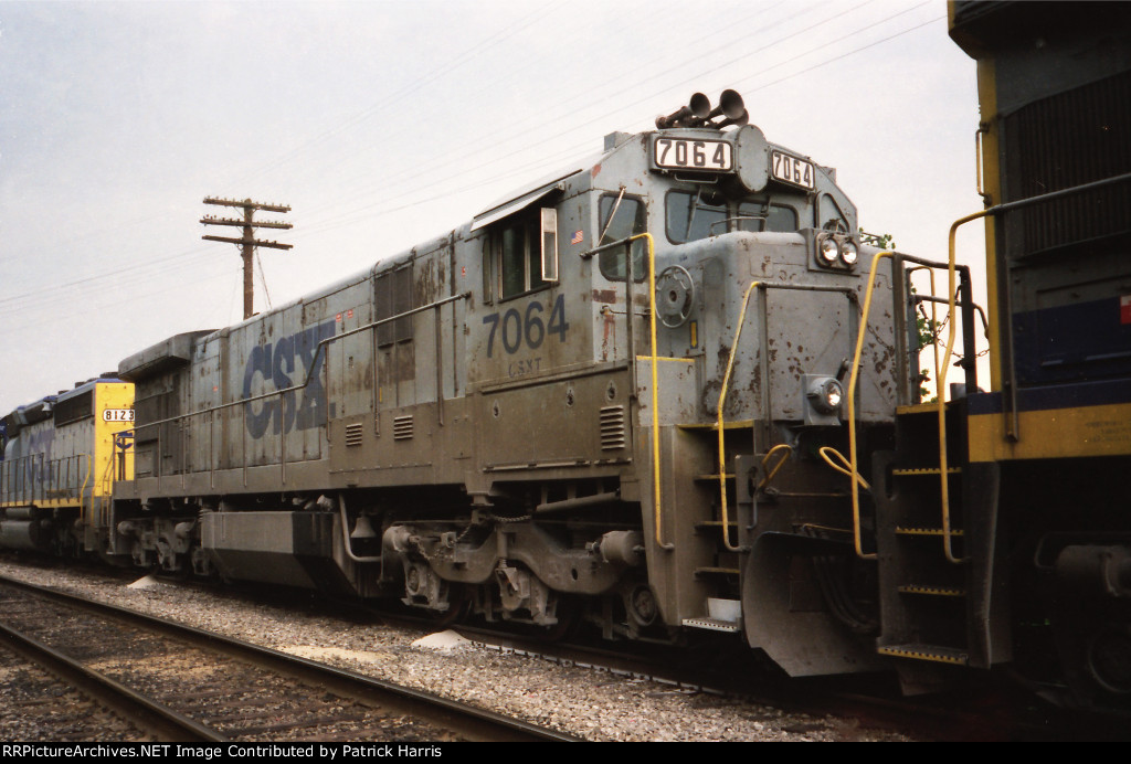 CSX 7064 C30-7 full stealth scheme idling awaiting clearance southbound at Kentucky Street on ...